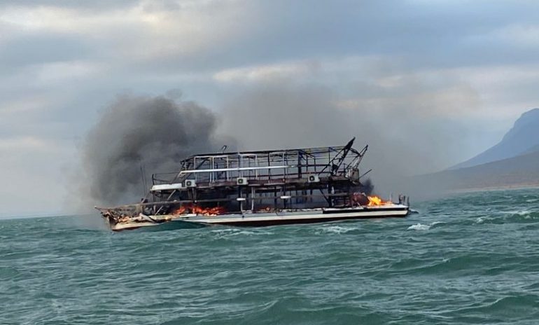 Search continues for missing crewman after luxury houseboat fire