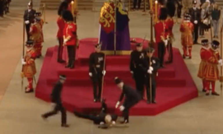 WATCH: Royal guard collapses while guarding Queen's coffin